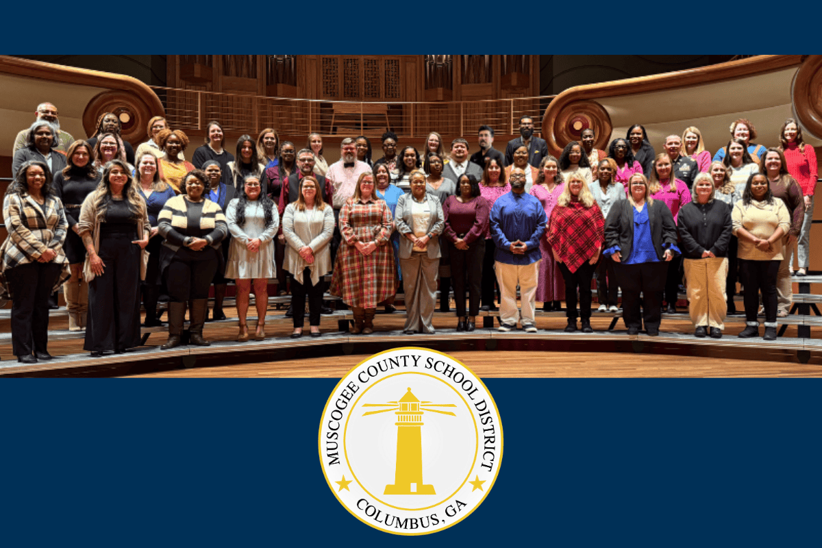 Group picture of teachers standing on risers with the Muscogee County ...