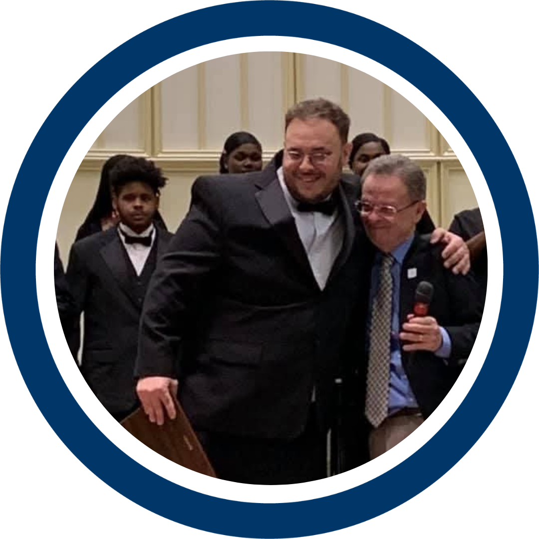 Matthew White hugging Doyle Register